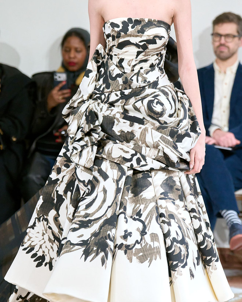 Strapless Wickstead evening gown with black and beige floral print and voluminous draped skirt for fall winter